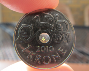 Refraction of light in water - coins and lenses. - Adventures in ...