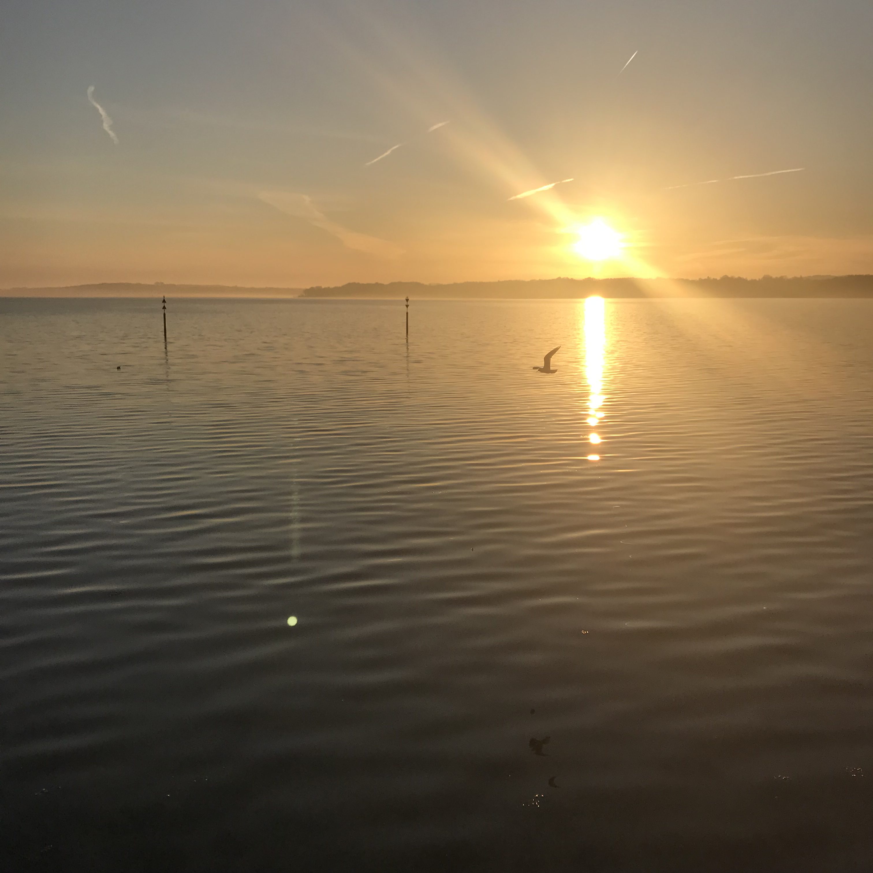 Determining the slope of sea surface via the reflection of a structure ...