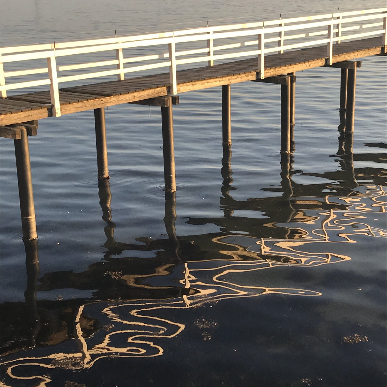 Determining the slope of sea surface via the reflection of a structure ...