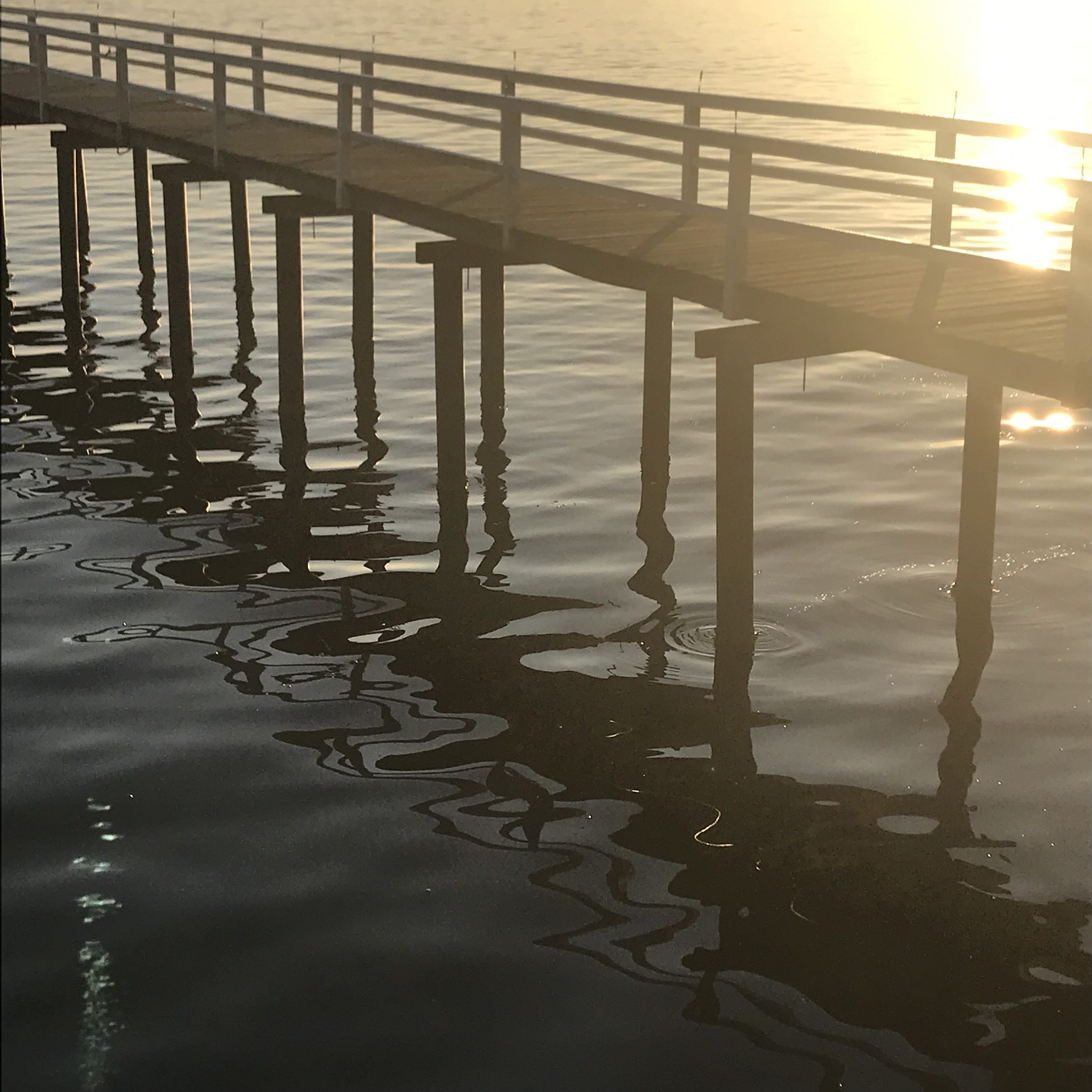 Determining the slope of sea surface via the reflection of a structure ...