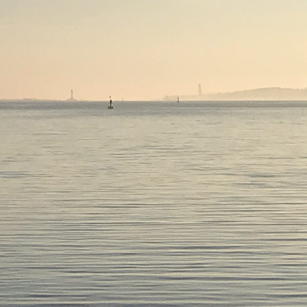 Determining the slope of sea surface via the reflection of a structure ...